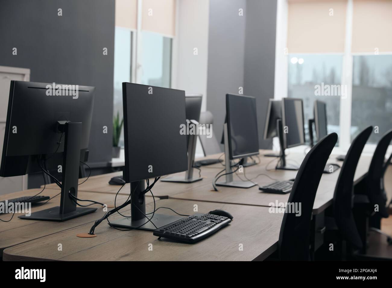 Rows of computers in empty office hi-res stock photography and images ...