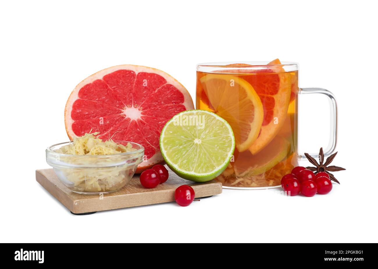 Glass cup of immunity boosting drink and ingredients on white ...