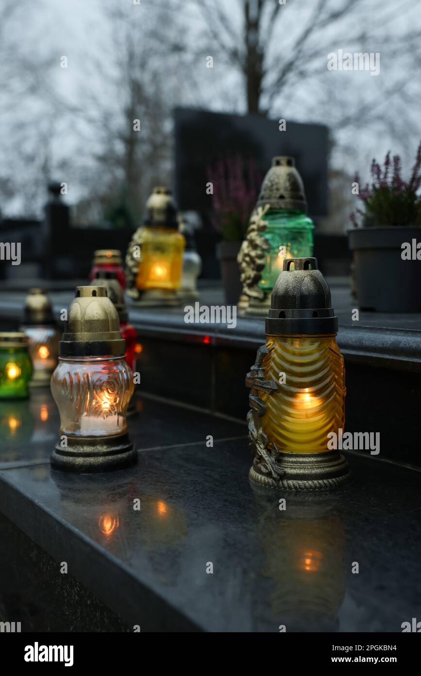 Grave lights on granite surface at cemetery Stock Photo - Alamy