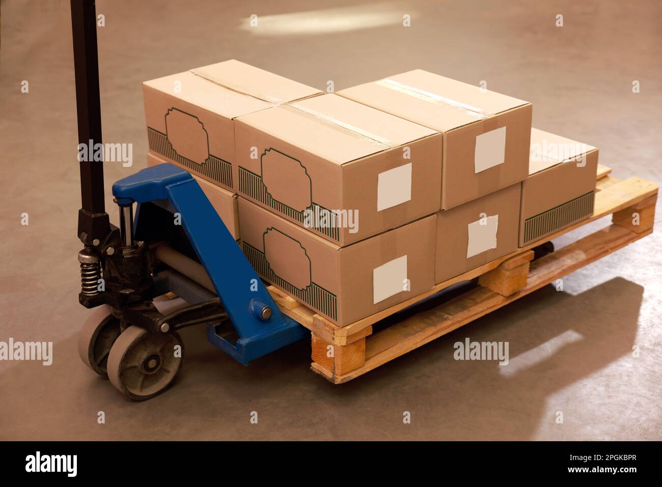 Manual forklift with cardboard boxes in warehouse. Logistics concept ...