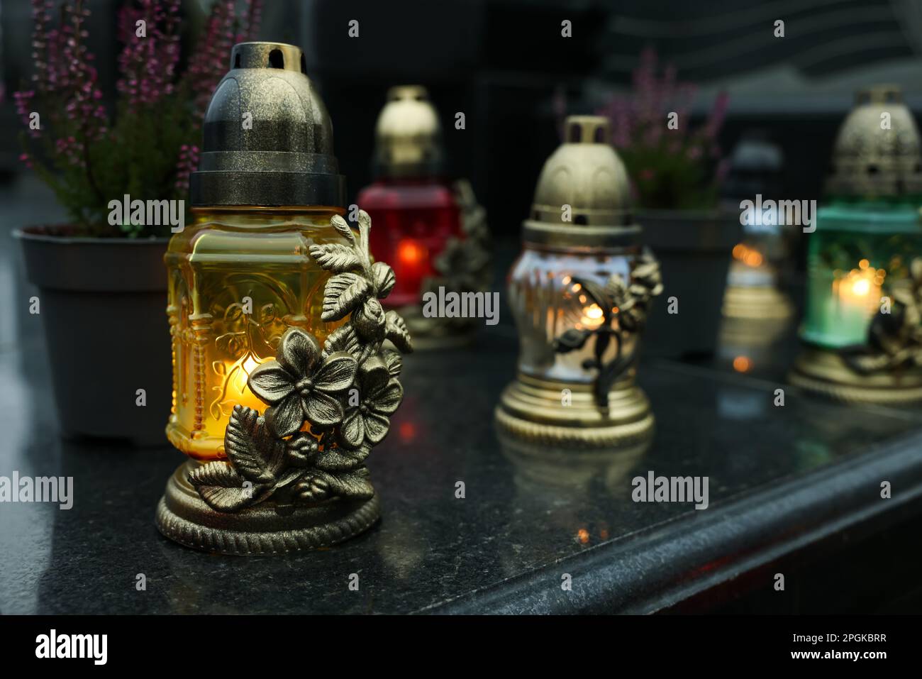 Grave lights on granite surface at cemetery Stock Photo - Alamy