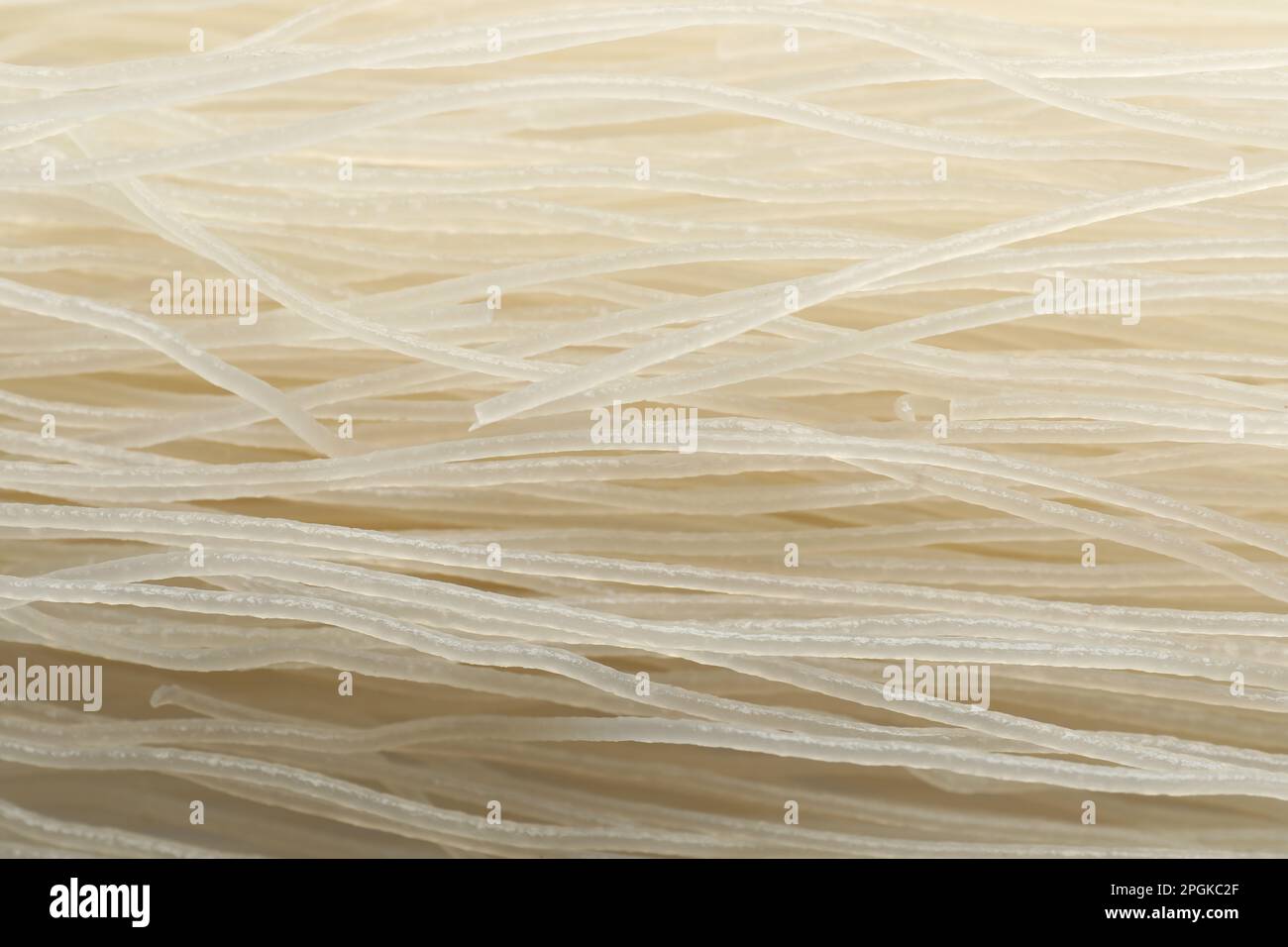 Closeup view of dried rice noodles as background Stock Photo - Alamy