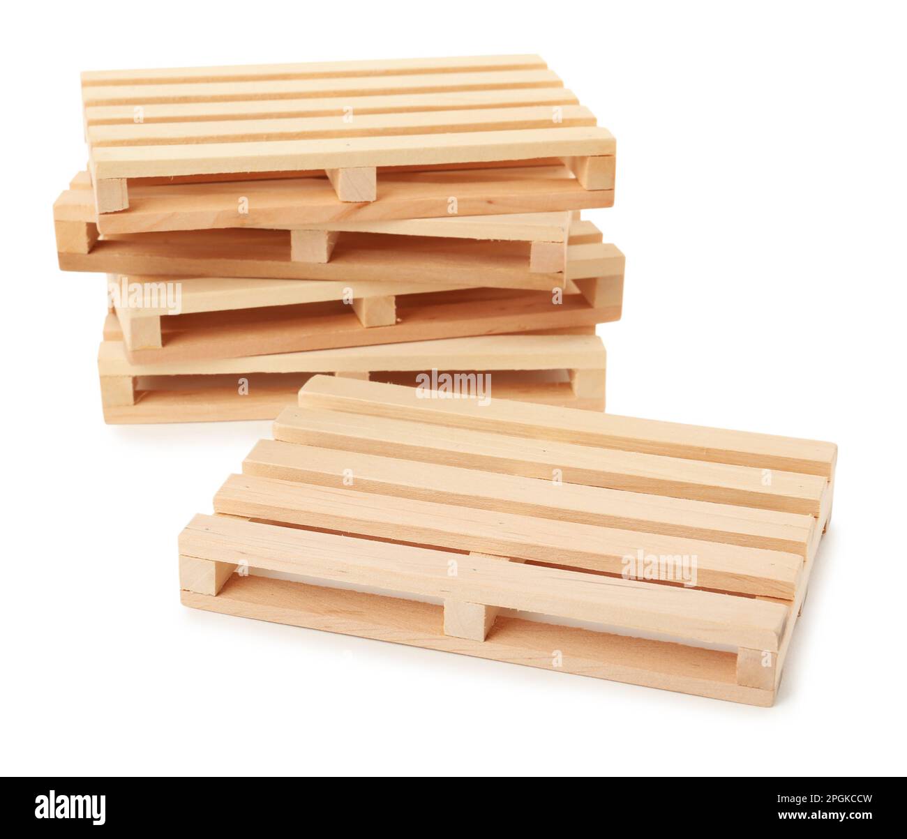 Many small wooden pallets on white background Stock Photo - Alamy