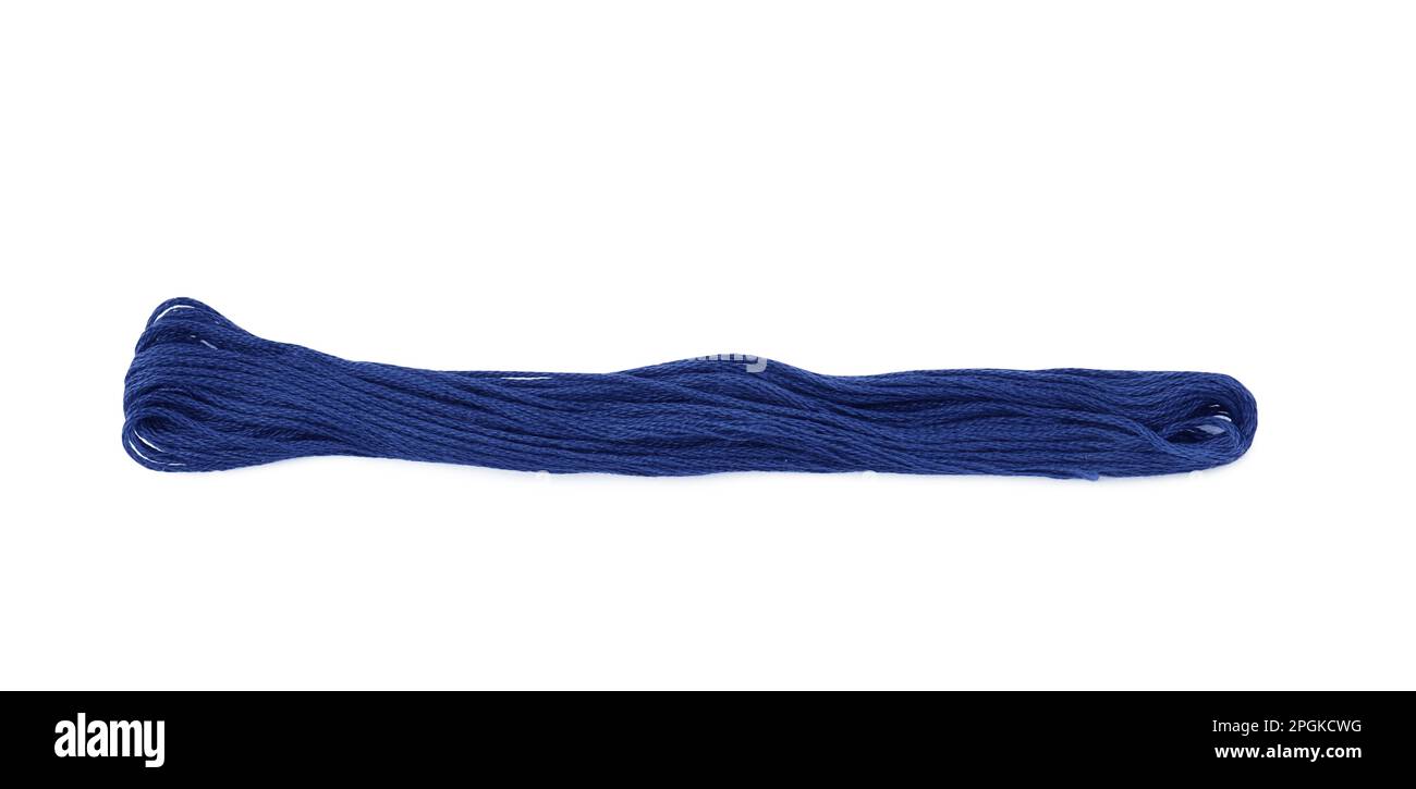 Bright blue embroidery thread on white background Stock Photo - Alamy