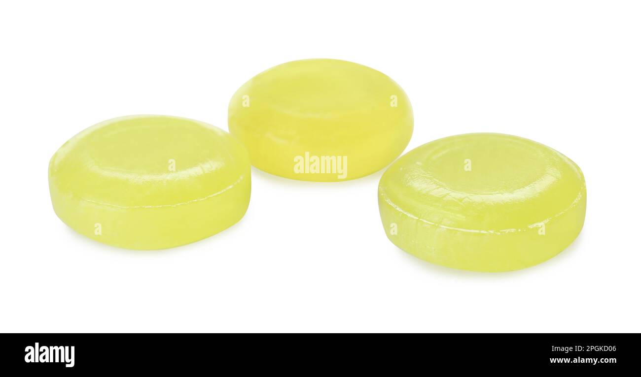 Three yellow cough drops on white background Stock Photo - Alamy