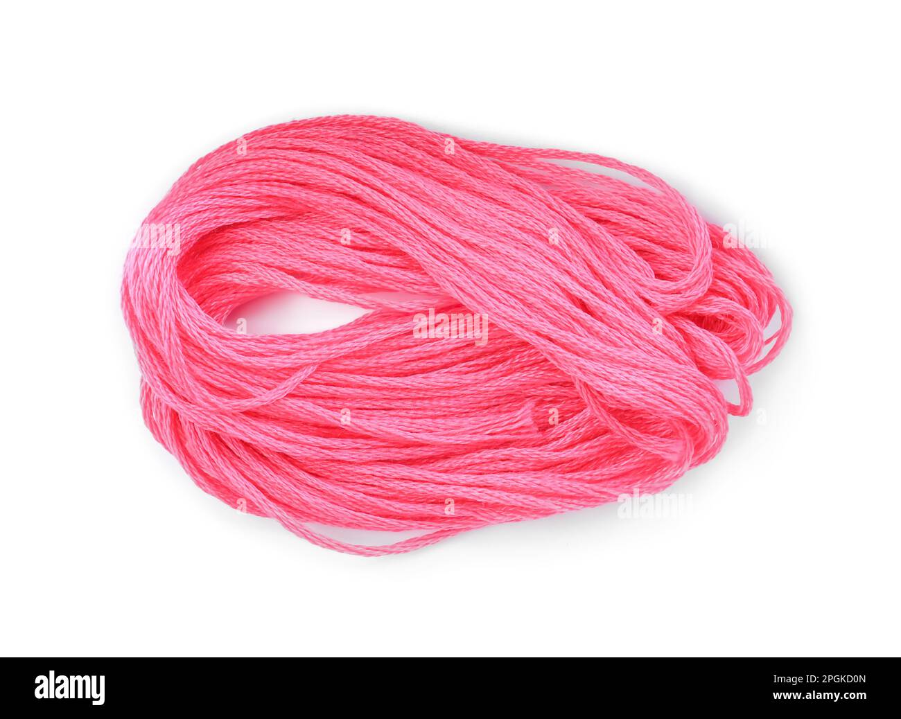 Bright pink embroidery thread on white background Stock Photo - Alamy