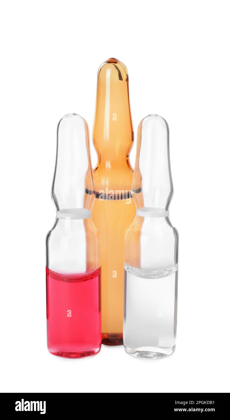 Different ampoules with pharmaceutical products on white background ...