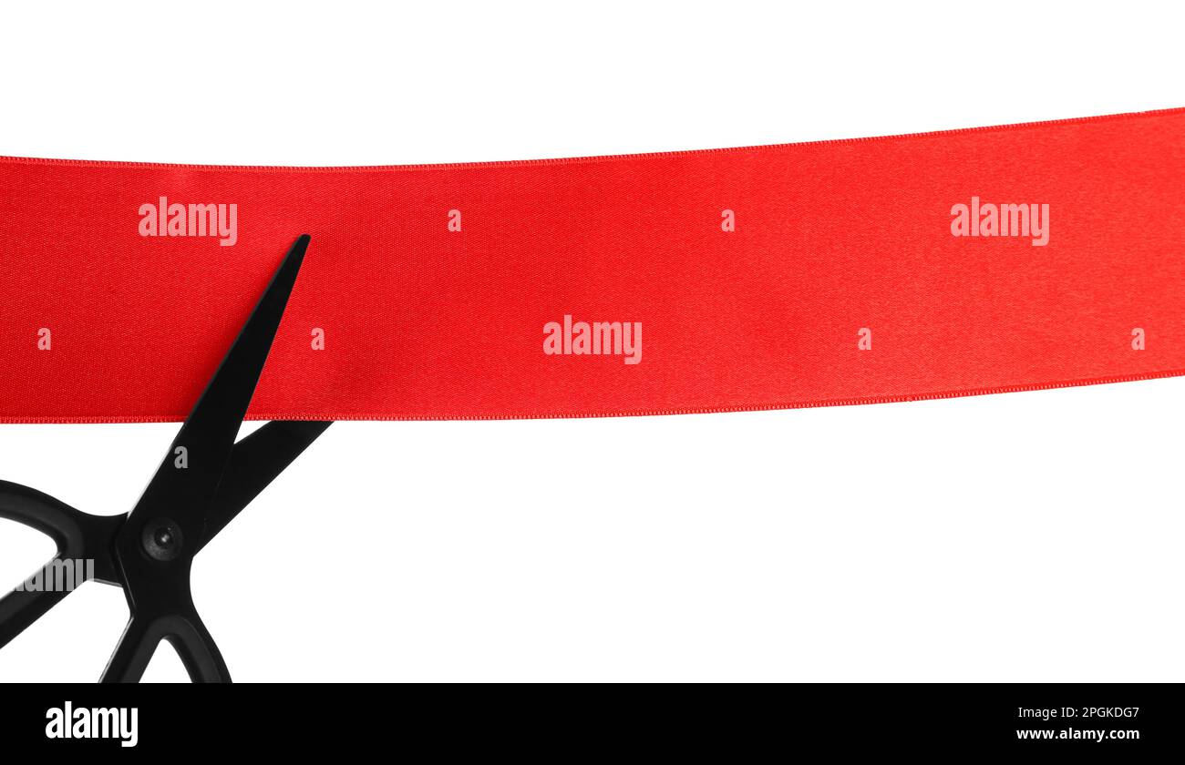 Cutting red ribbon with scissors on white background Stock Photo - Alamy