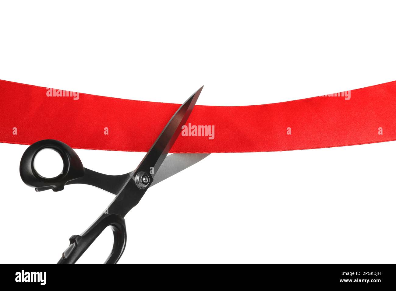 Cutting red ribbon with scissors on white background Stock Photo - Alamy