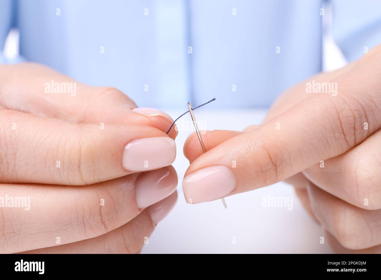 Closeup woman hands threading sewing hi-res stock photography and ...