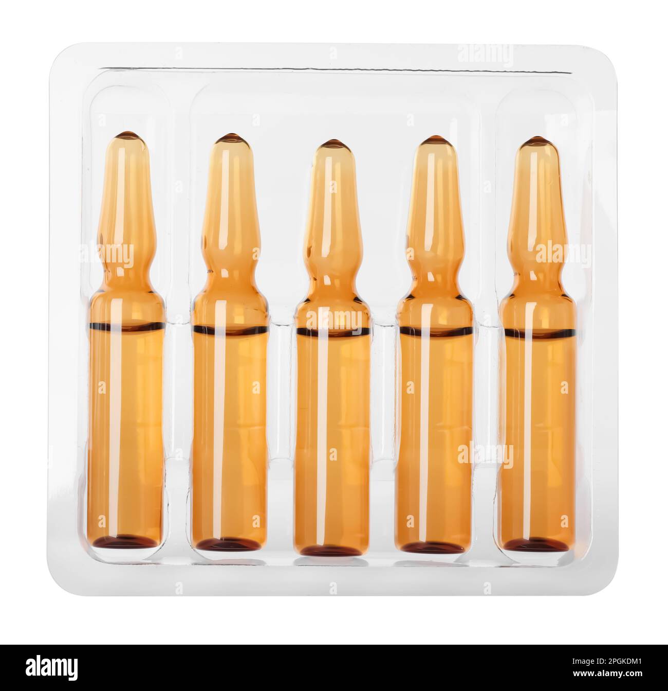 Glass ampoules with pharmaceutical product in tray on white background ...