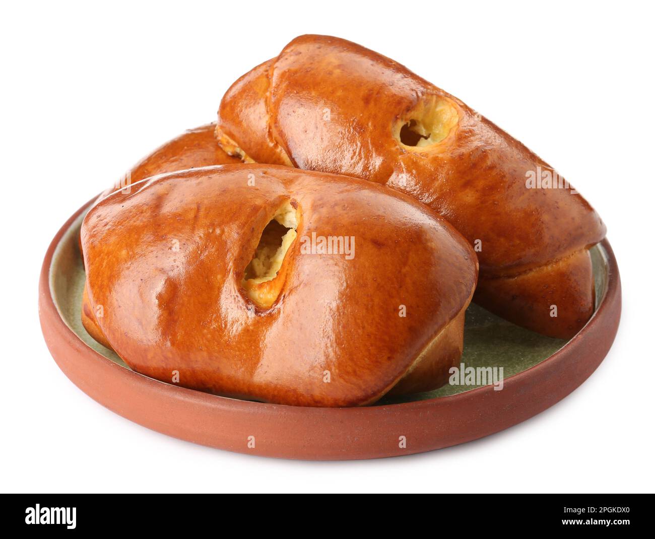 Plate with delicious baked patties on white background Stock Photo - Alamy
