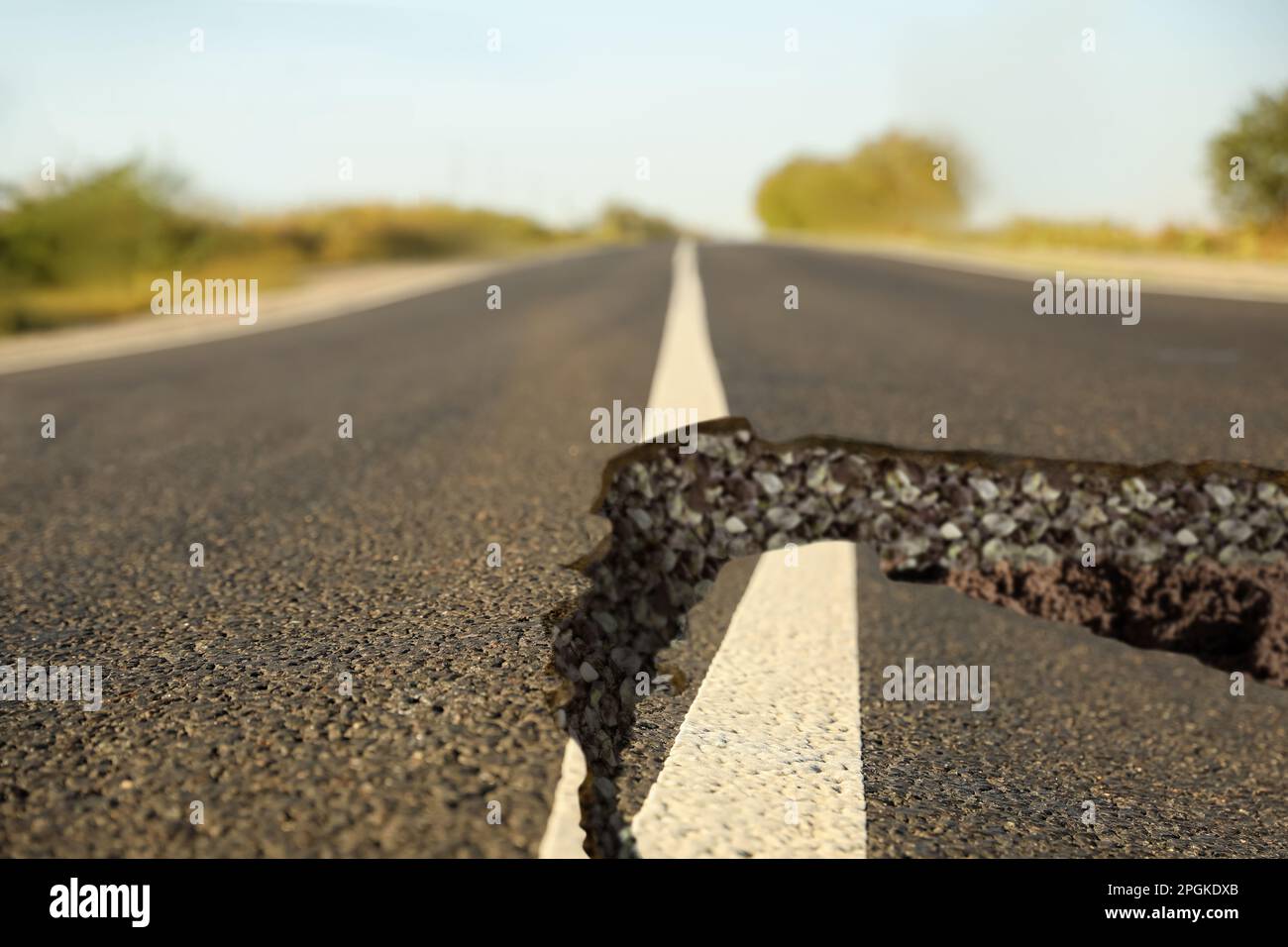Large crack on asphalt road after earthquake Stock Photo - Alamy