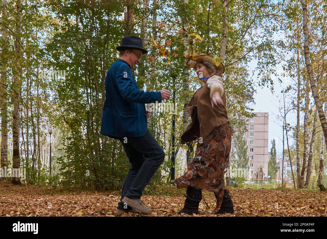 Woman walking in park dancing hi-res stock photography and images - Alamy