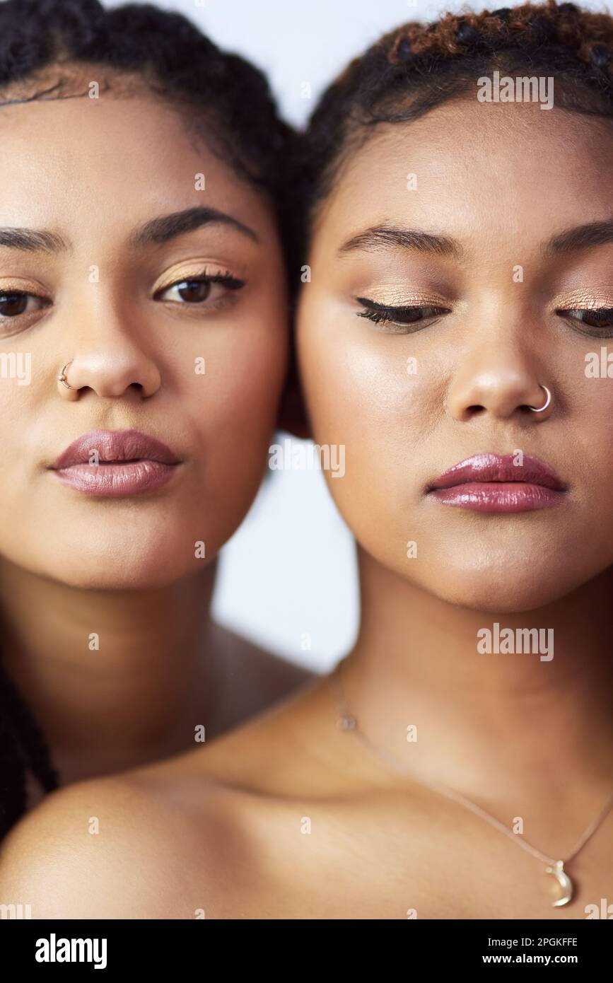 Looking better together naturally. Studio shot of two beautiful young ...