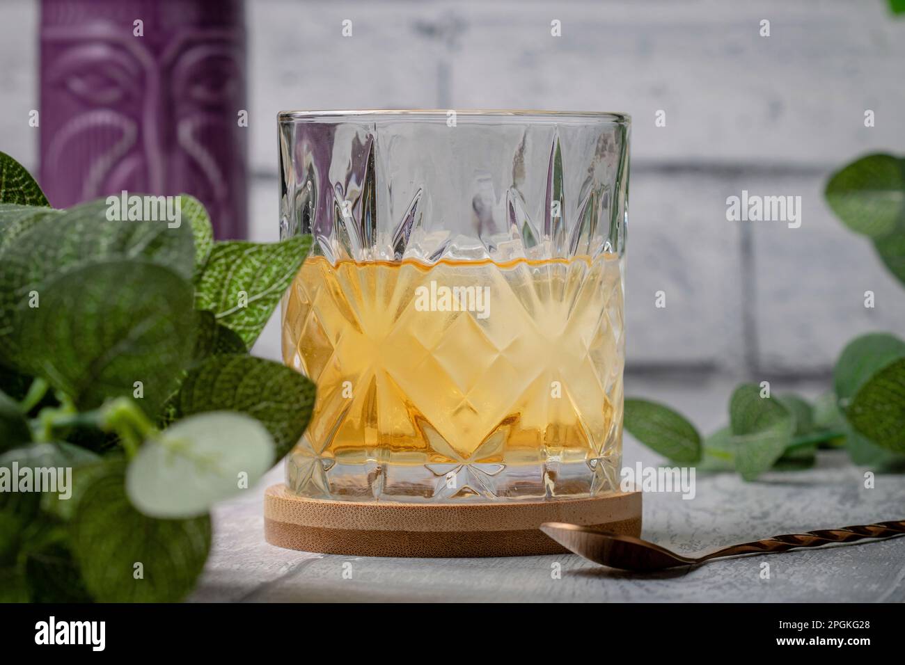 This image shows a Rum Old Fashioned cocktail. The Rum Old Fashioned is ...