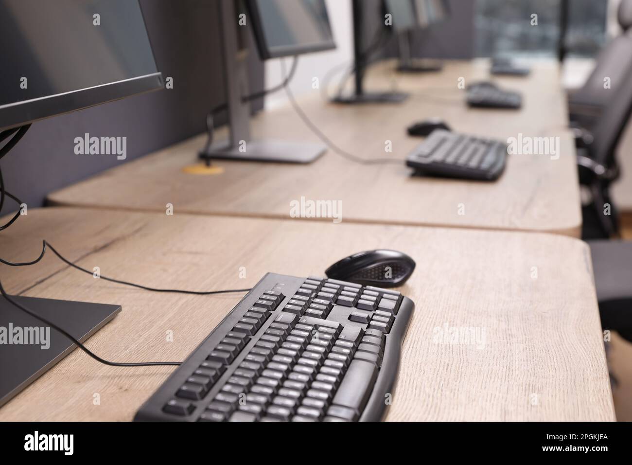 Many modern computers in open space office, closeup Stock Photo - Alamy
