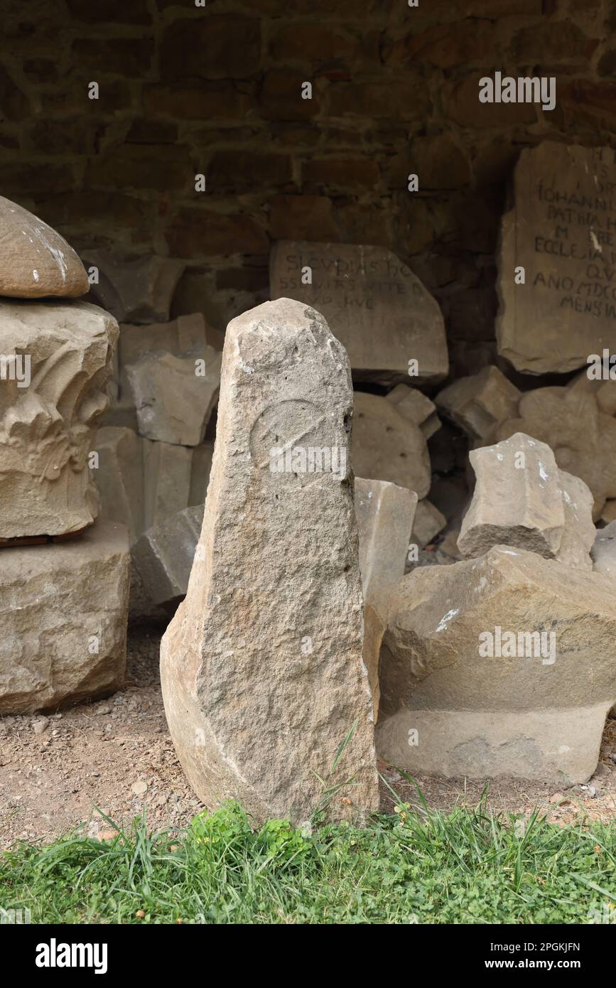 Lapidarium in Cârța Monastery, Romania, with symbol encarved on a stone ...