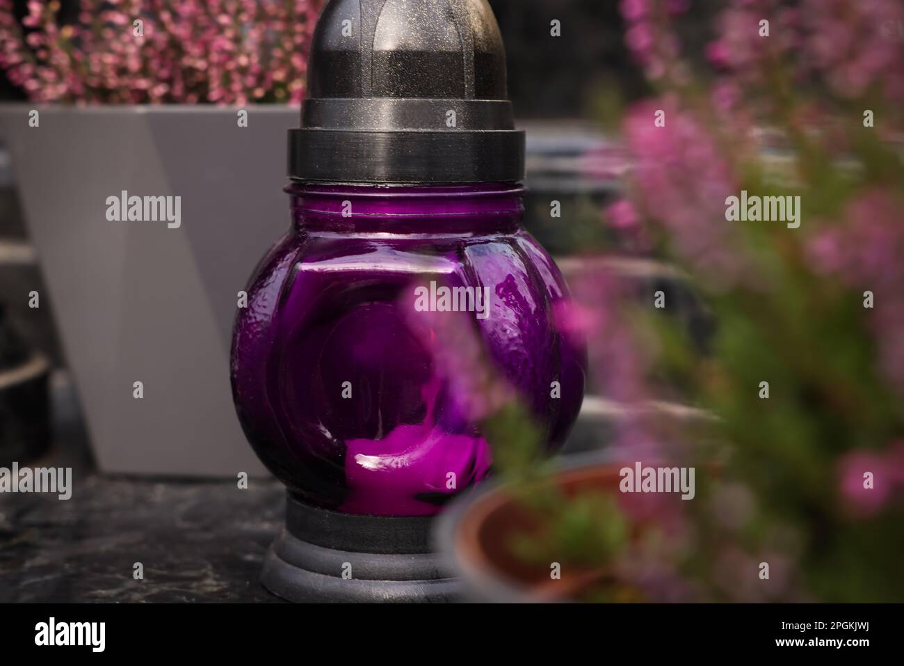 Grave lantern on granite surface at cemetery, closeup Stock Photo - Alamy