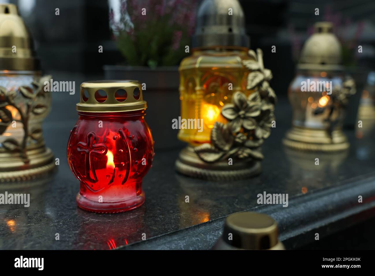 Grave lights on granite surface at cemetery Stock Photo - Alamy
