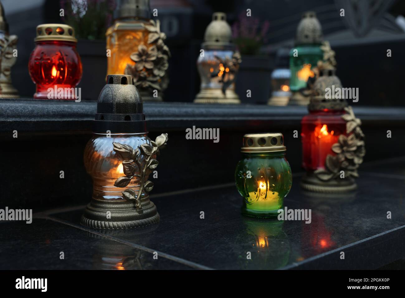 Grave lights on granite surface at cemetery Stock Photo - Alamy