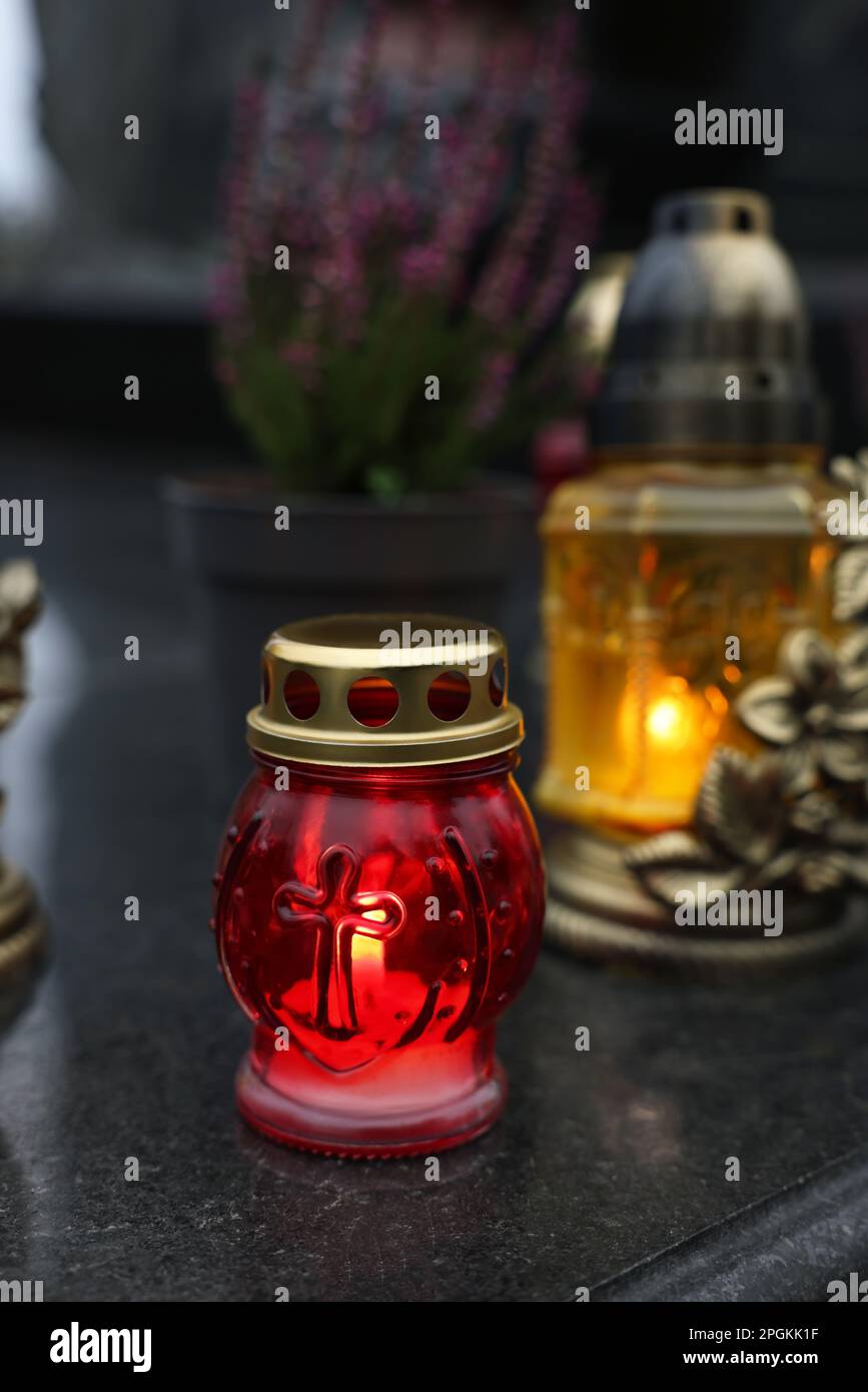 Grave lights on granite surface at cemetery Stock Photo - Alamy