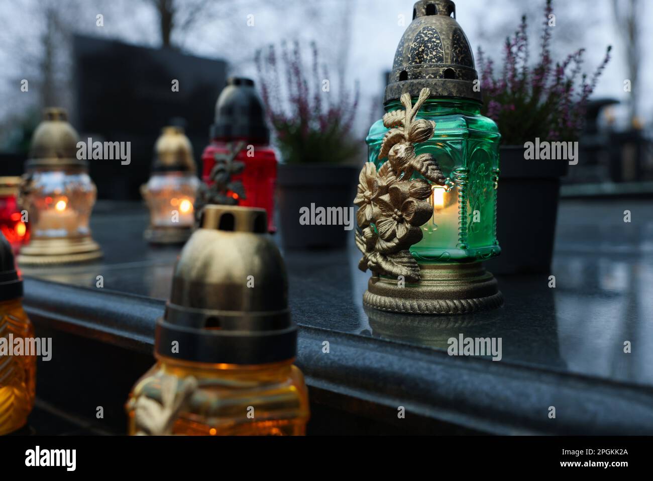 Grave lights on granite surface at cemetery Stock Photo - Alamy