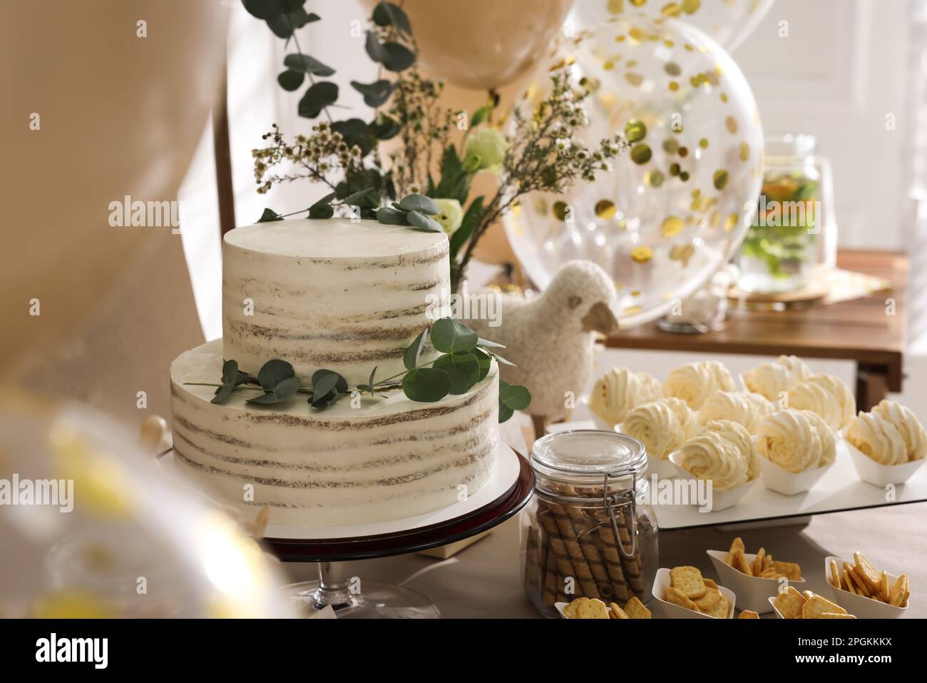 Beautiful cake and other treats on table in room. Sweet buffet Stock ...