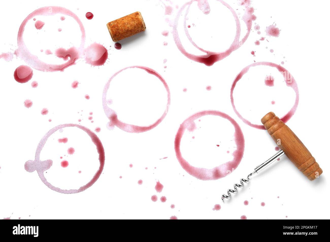 Red wine rings, drops, bung and corkscrew on white background, top view ...