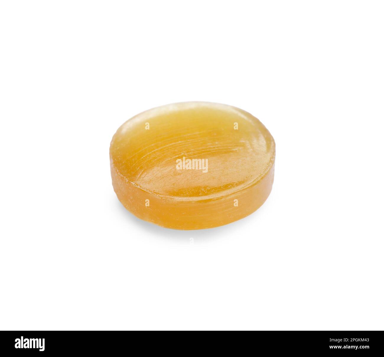 One yellow cough drop isolated on white Stock Photo - Alamy