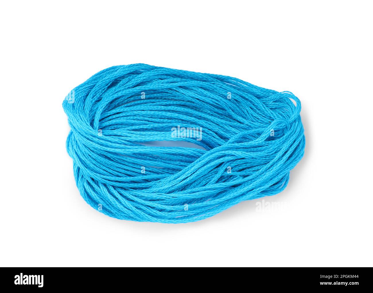 Light blue embroidery thread on white background Stock Photo - Alamy