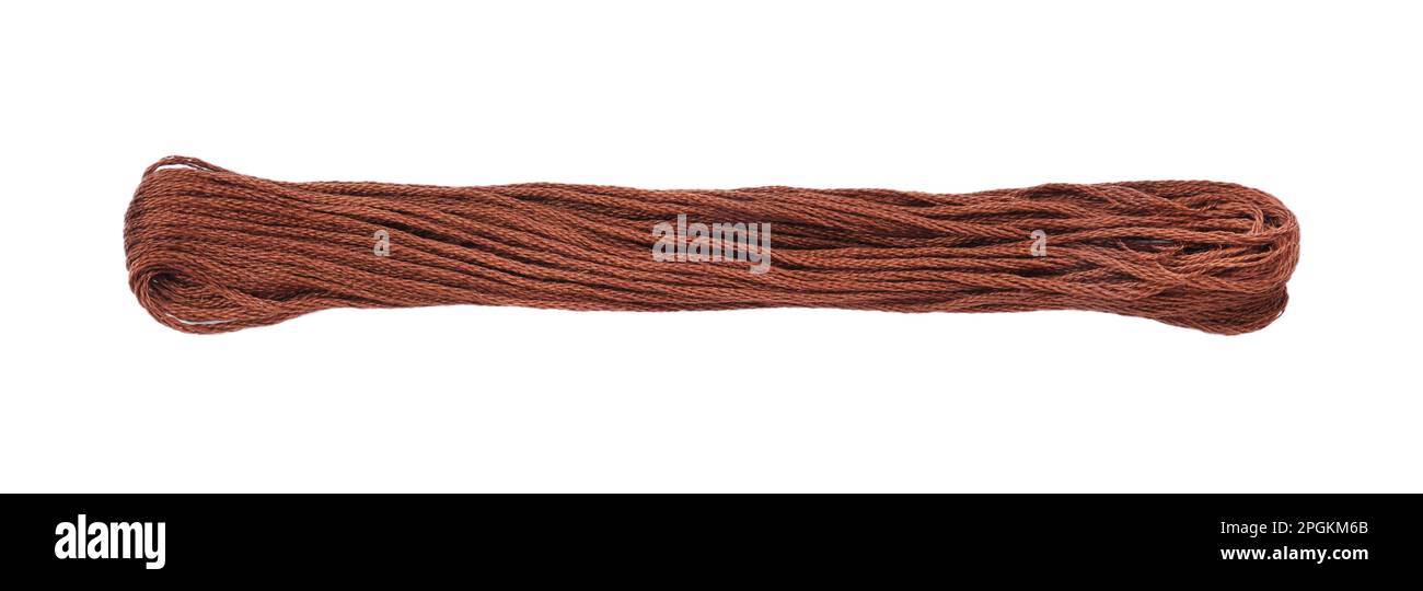 Bright brown embroidery thread on white background Stock Photo - Alamy