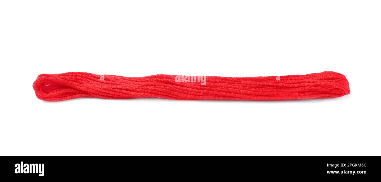 Bright red embroidery thread on white background Stock Photo - Alamy