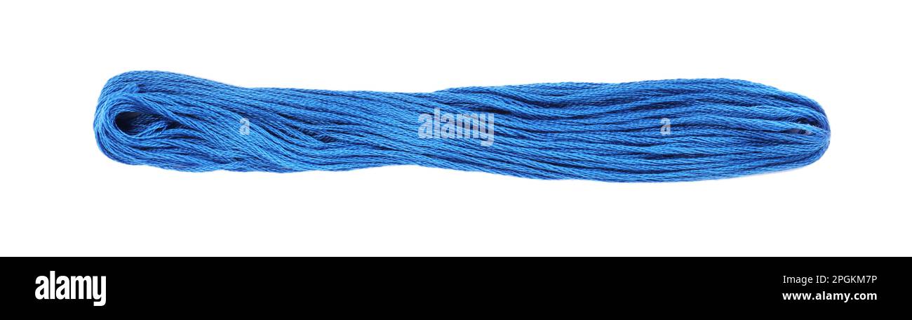Bright blue embroidery thread on white background Stock Photo - Alamy