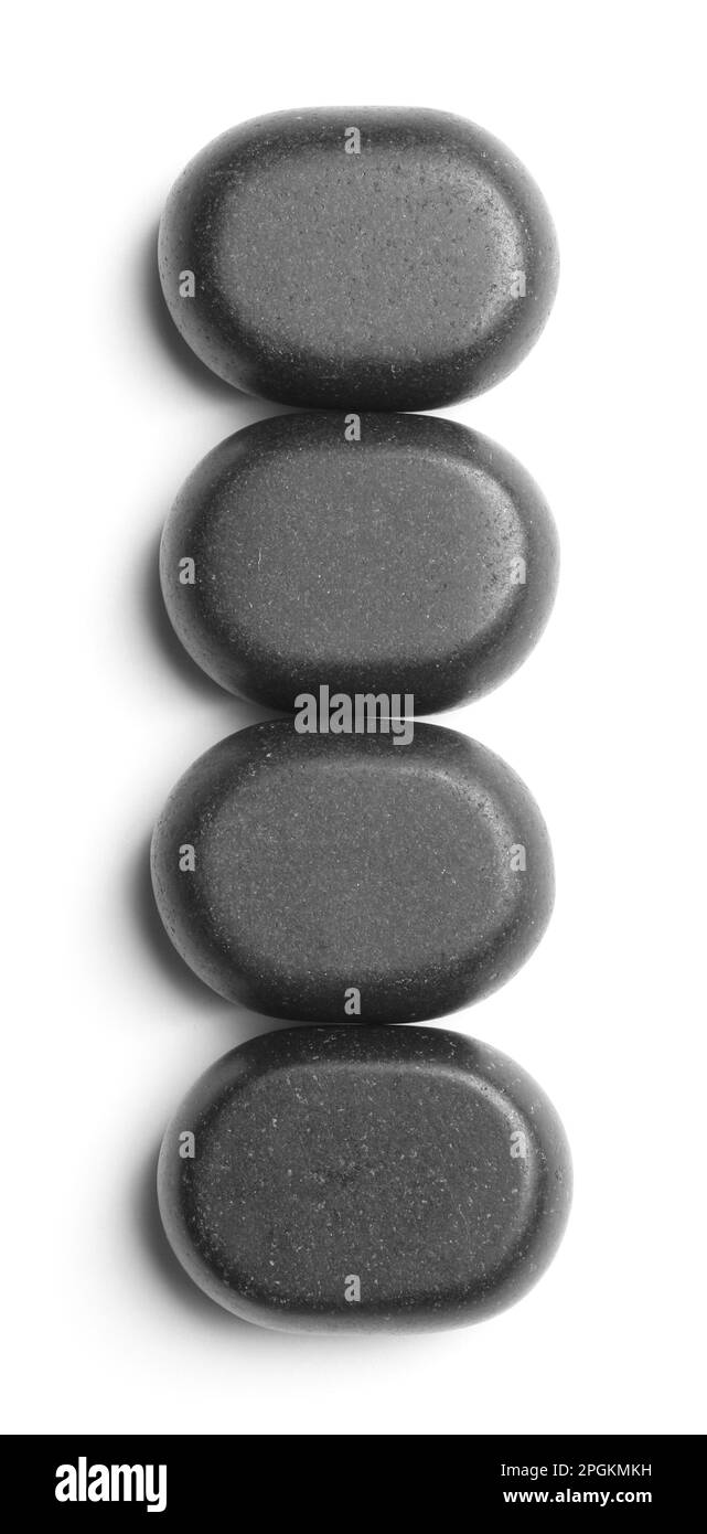 Group of black stones on white background, top view Stock Photo - Alamy