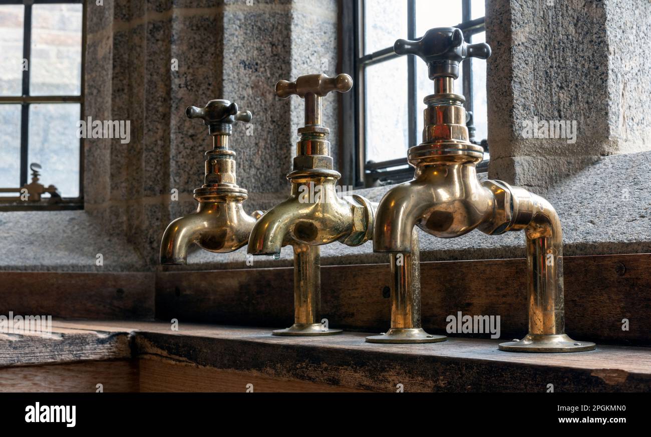 Brass vintage sink taps at Castle Dropo, Drewsteignton, Devon, England ...