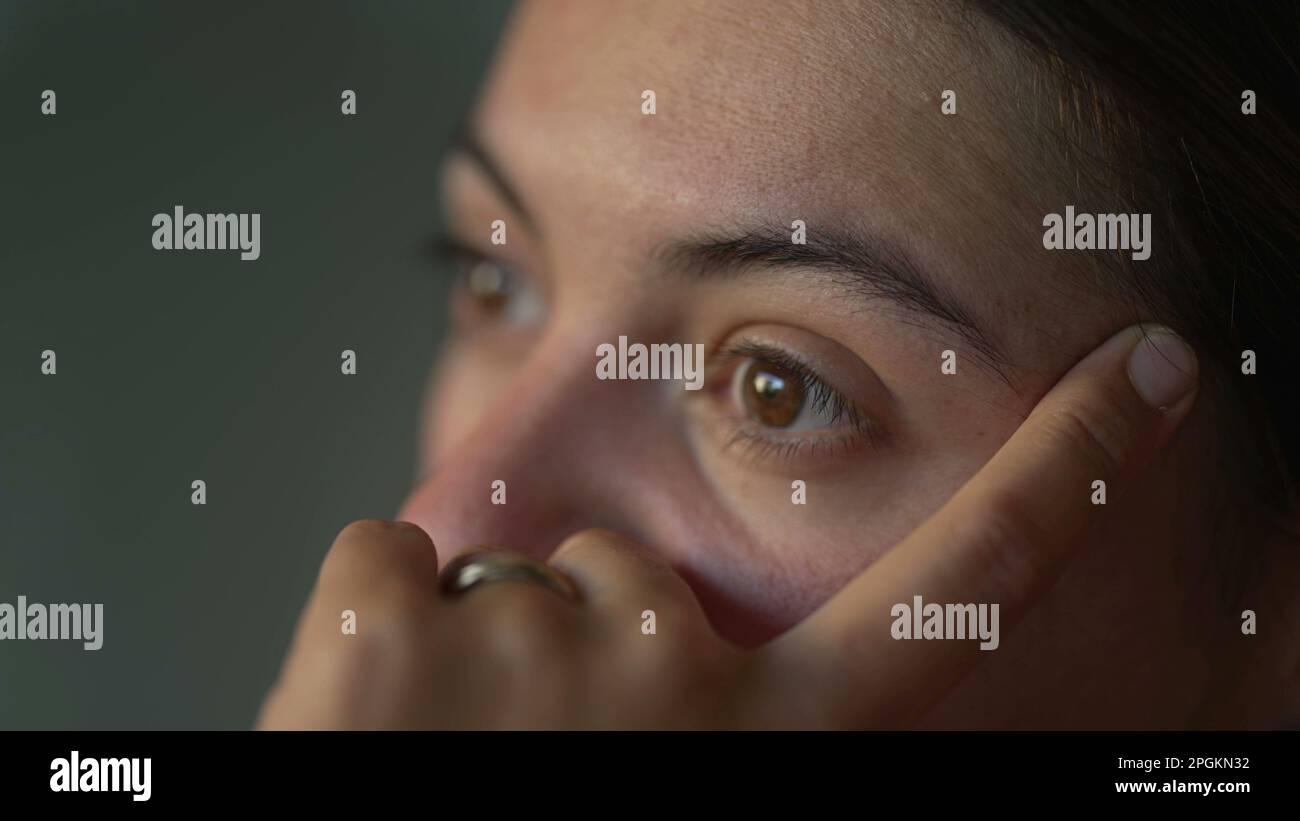 Closeup female 30s eyes in contemplation. Pensive thoughtful woman face ...