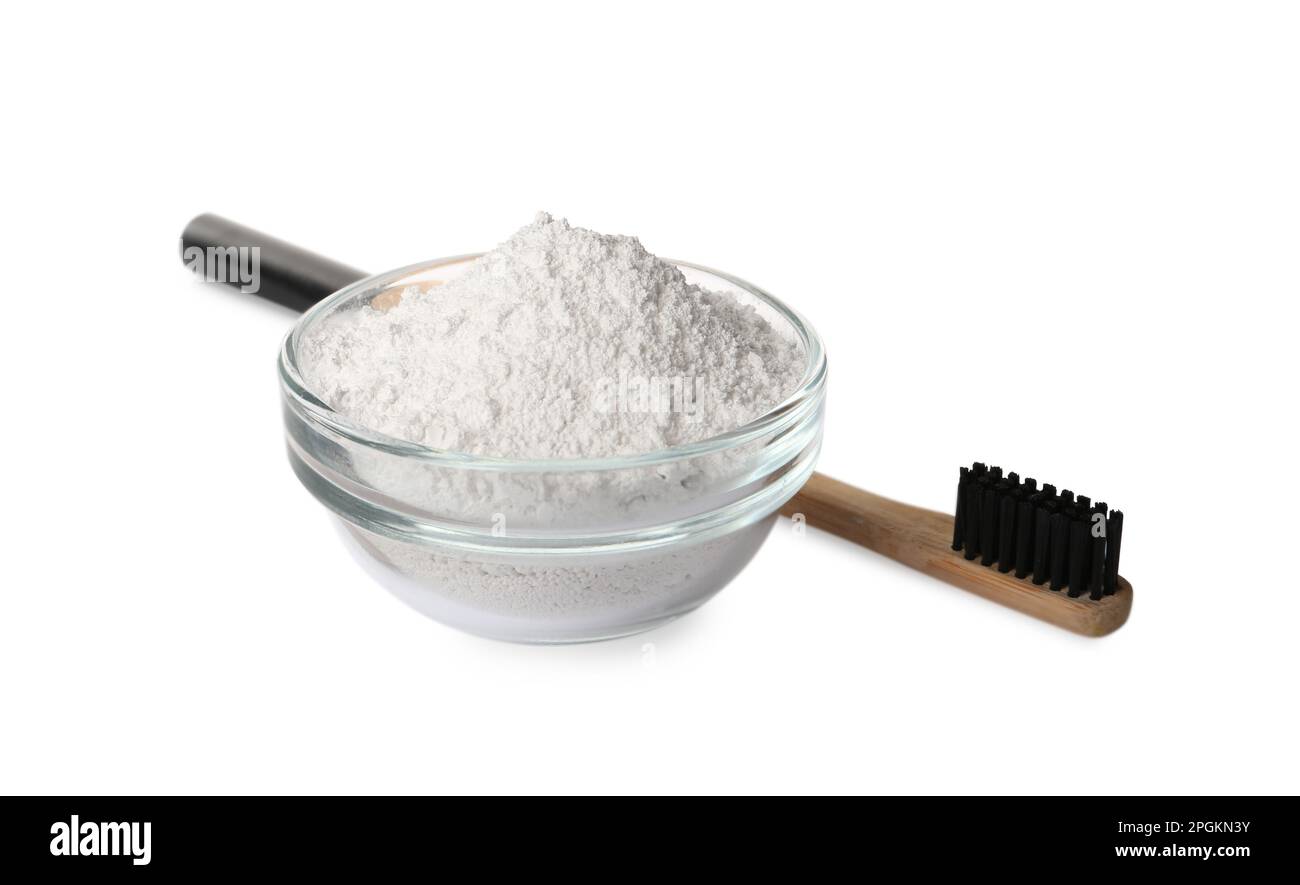 Glass bowl of tooth powder and brush on white background Stock Photo ...