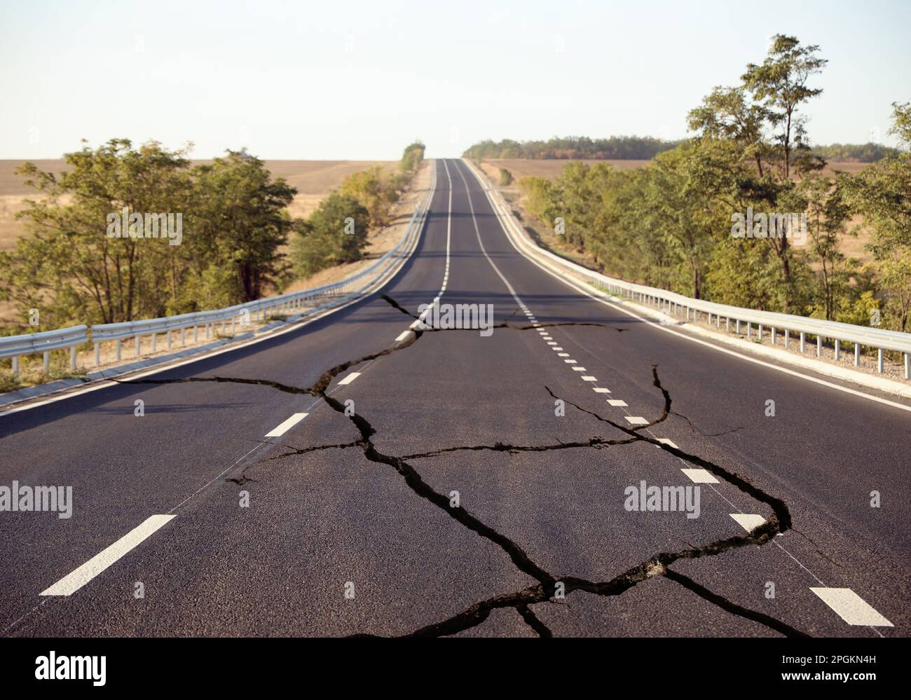 Large cracks on asphalt road after earthquake Stock Photo - Alamy