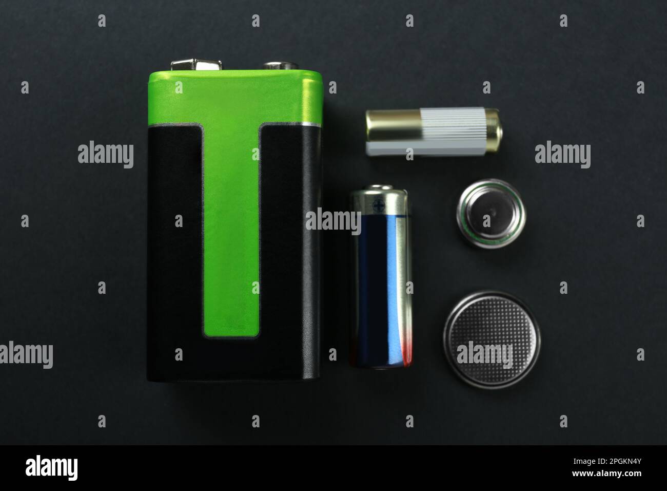 Different types of batteries on black background, flat lay Stock Photo ...