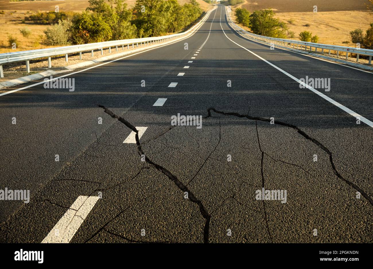 Large cracks on asphalt road after earthquake Stock Photo - Alamy