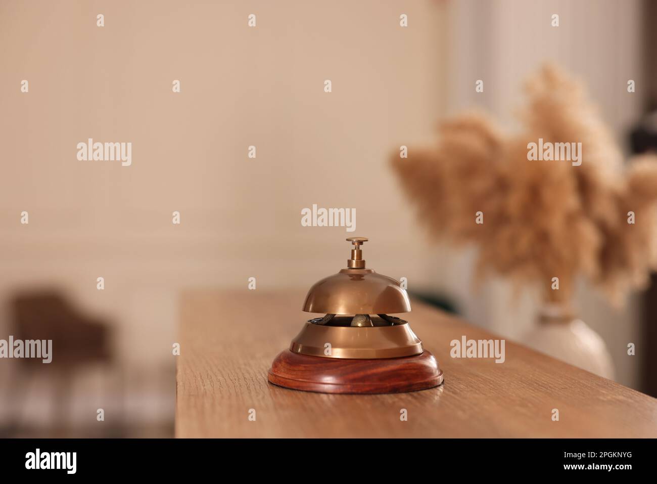 Service bell on wooden reception desk in hotel Stock Photo - Alamy