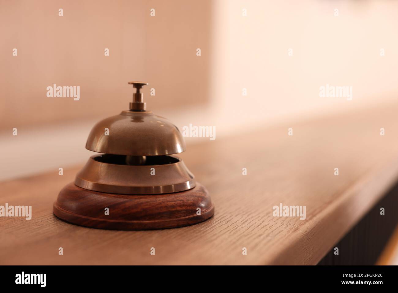 Hotel service bell on wooden reception desk. Space for text Stock Photo ...