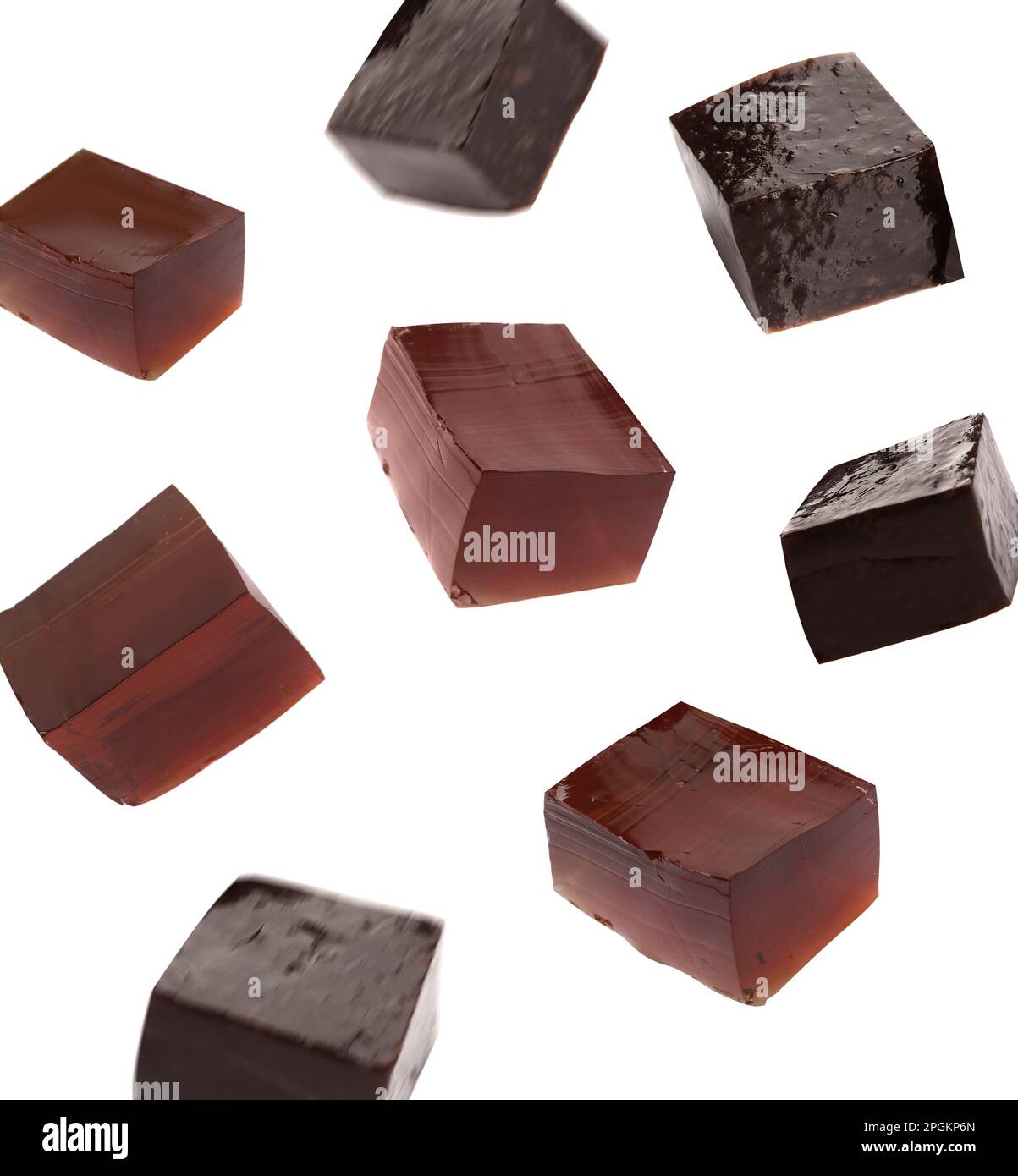 Tasty grass jelly cubes falling on white background Stock Photo - Alamy