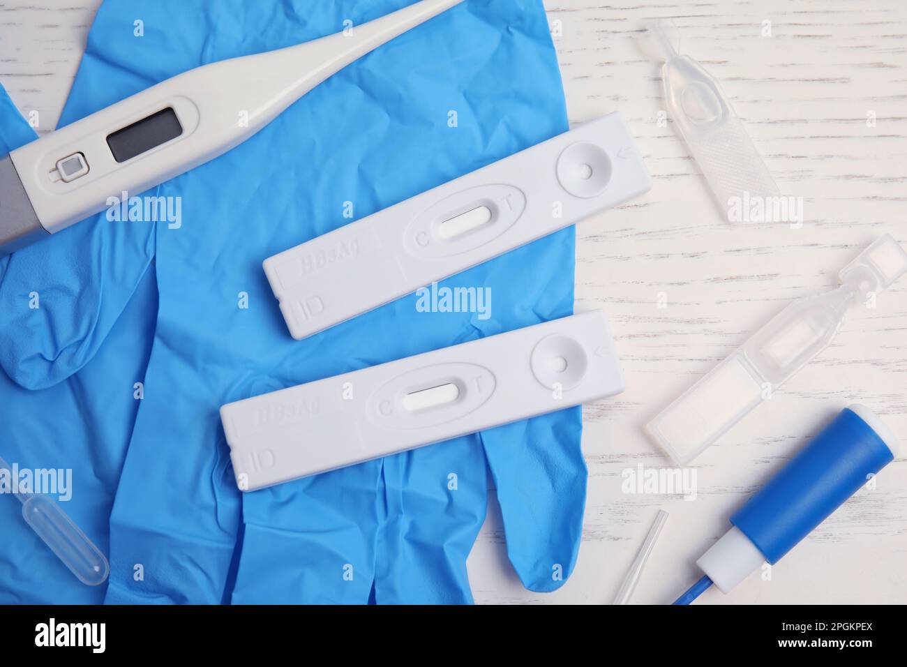 Disposable express test kit for hepatitis on white wooden table, flat ...