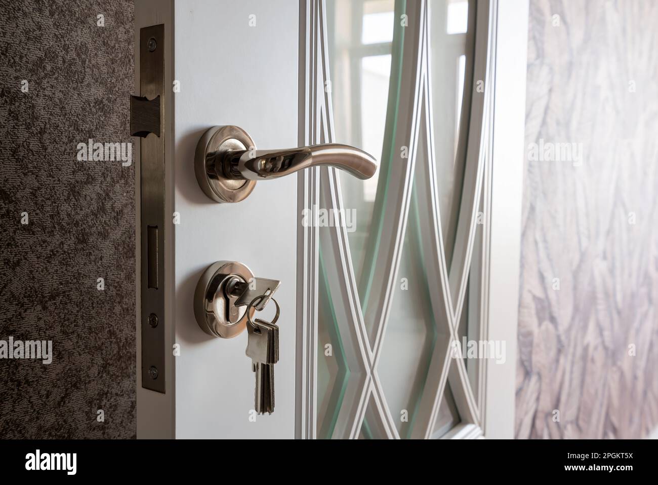 Door handle and keyhole with bunch of keys Stock Photo - Alamy