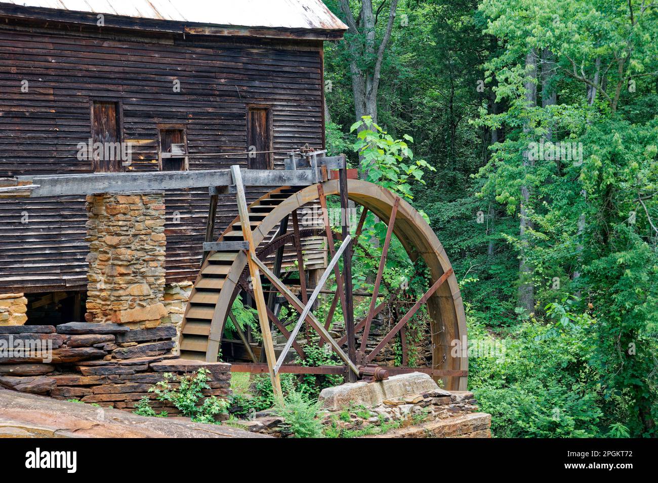A waterwheel use for energy by a creek for the wooden restored grist ...