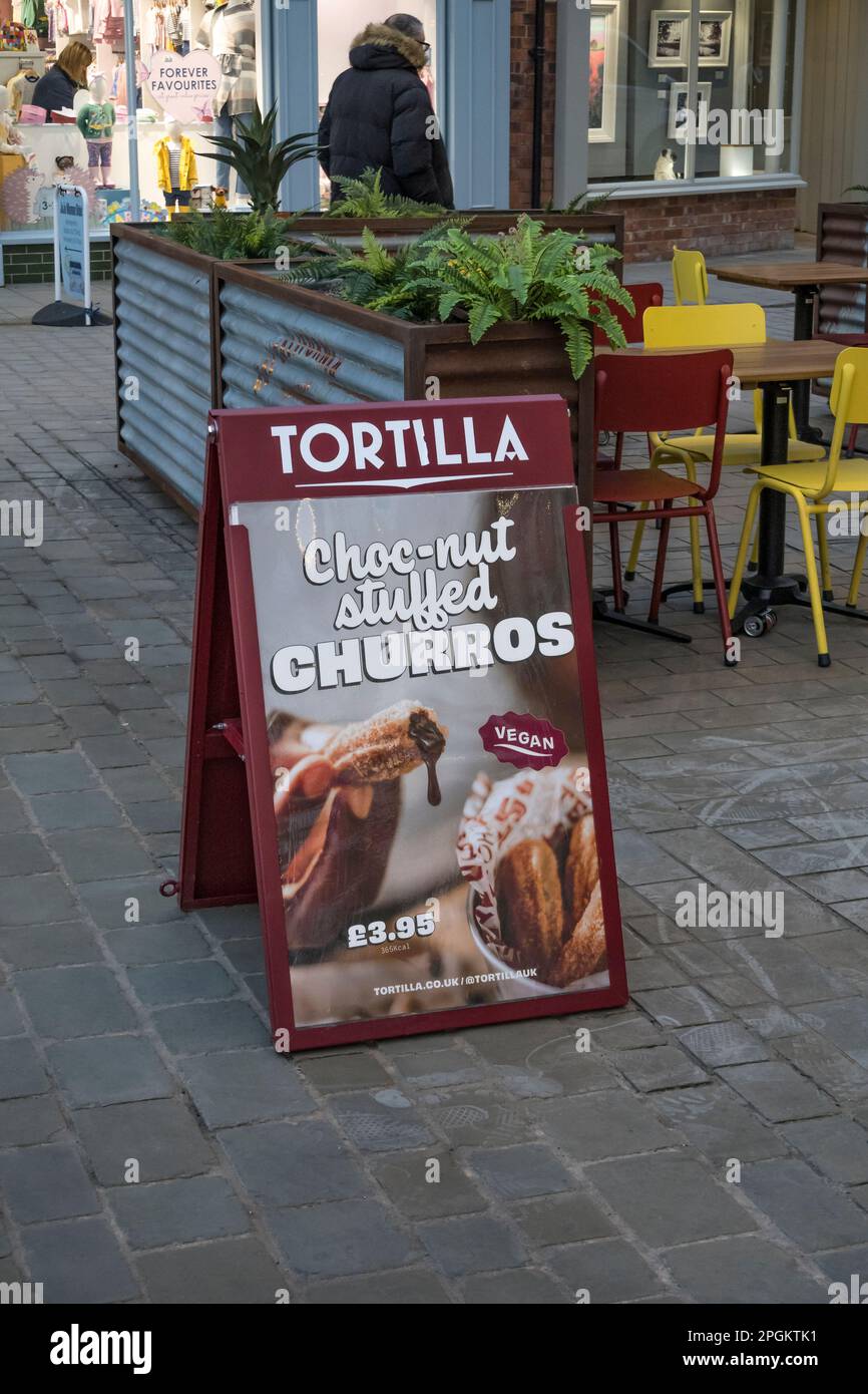 A - frame sign advertising choc-nut stuffed Churros at Tortilla food ...