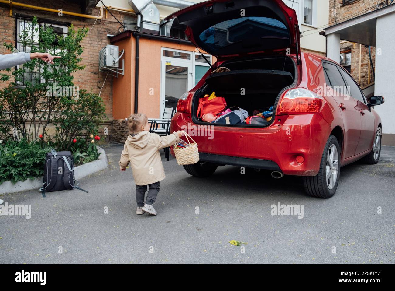 Girl loading luggage into car hi-res stock photography and images - Alamy