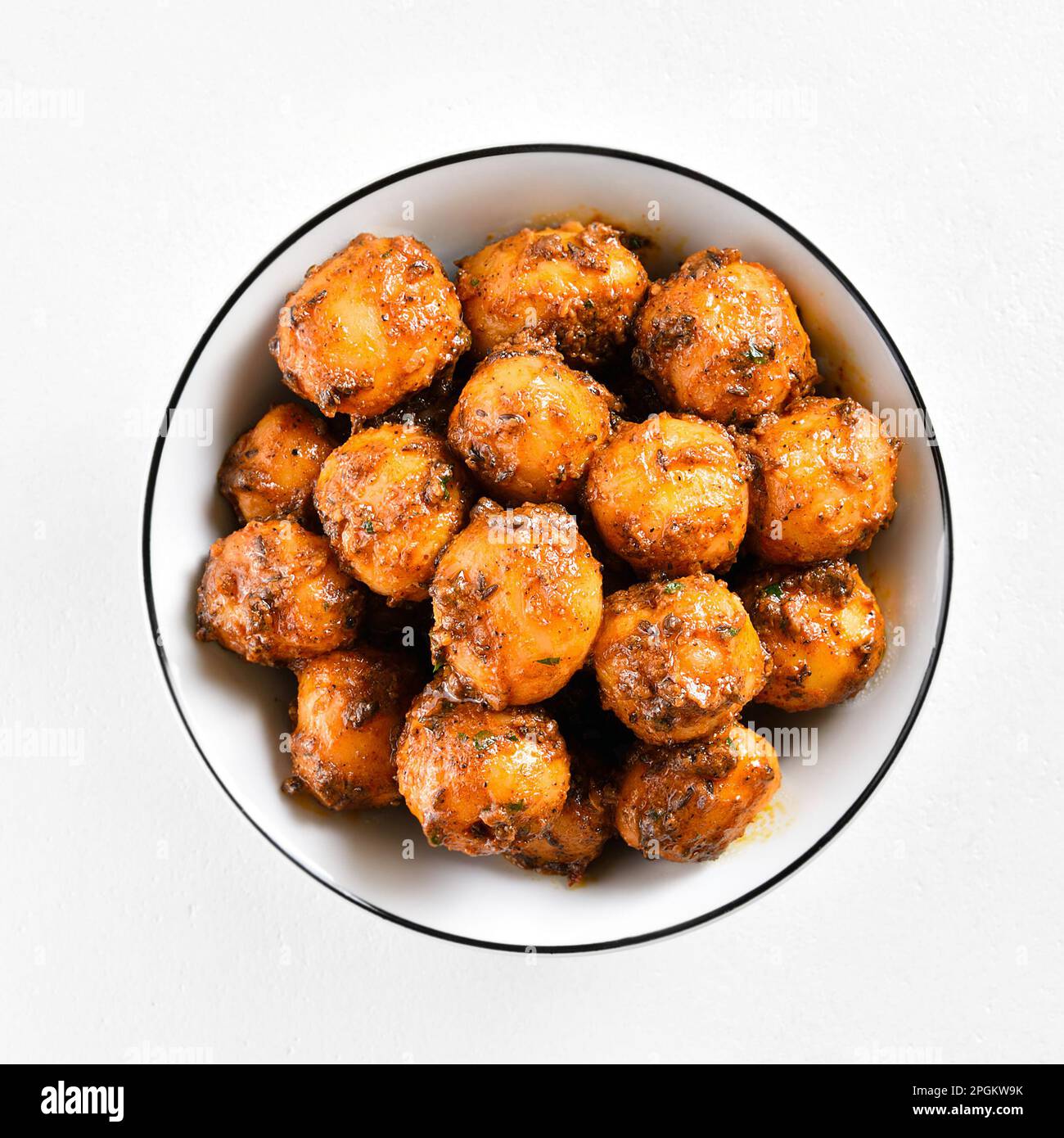 Close up view of pan fried little baby potatoes with jeera seeds and ...